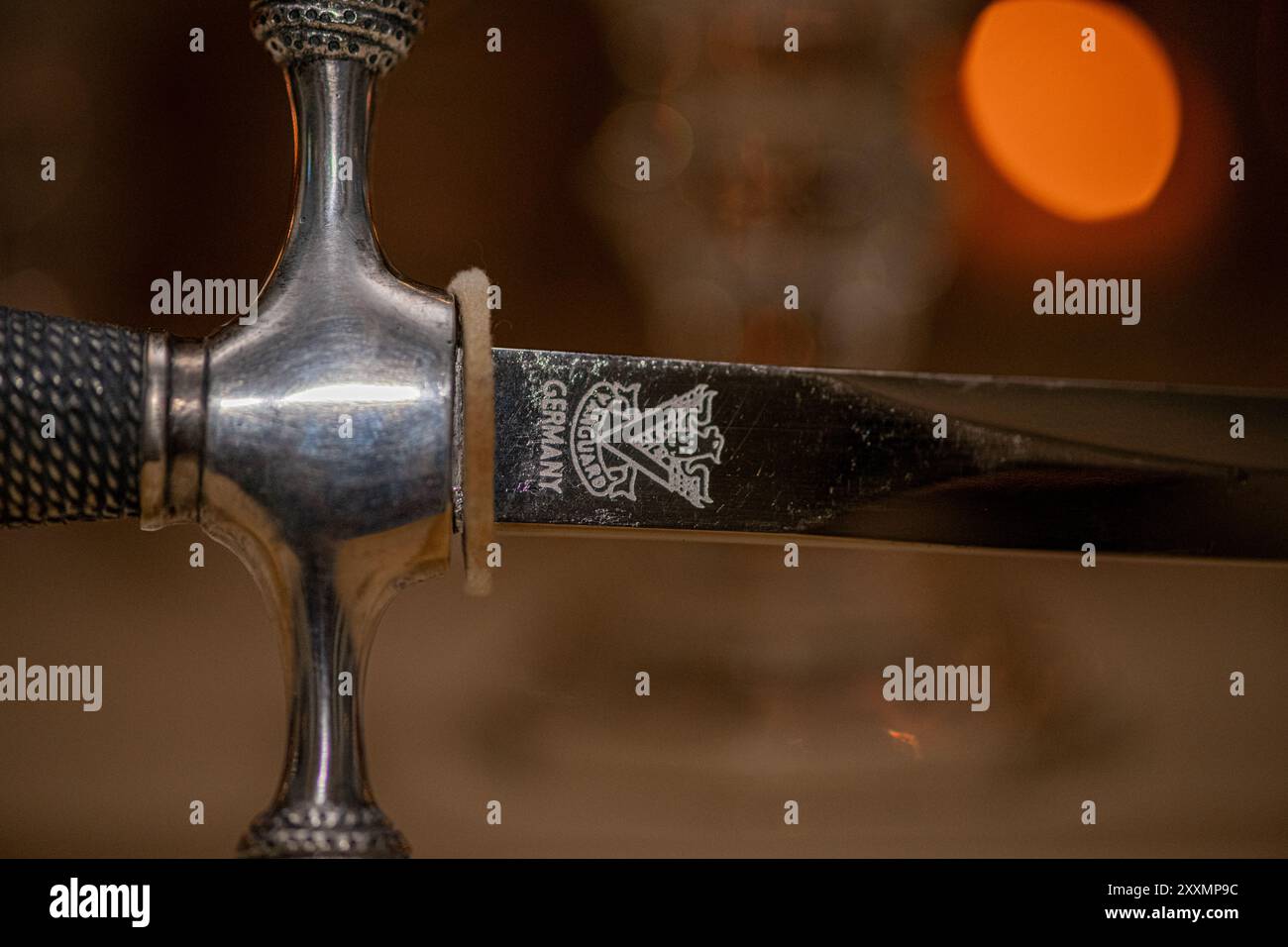 Silver medieva katana engraved sword blade on warm glowbackground Stock ...