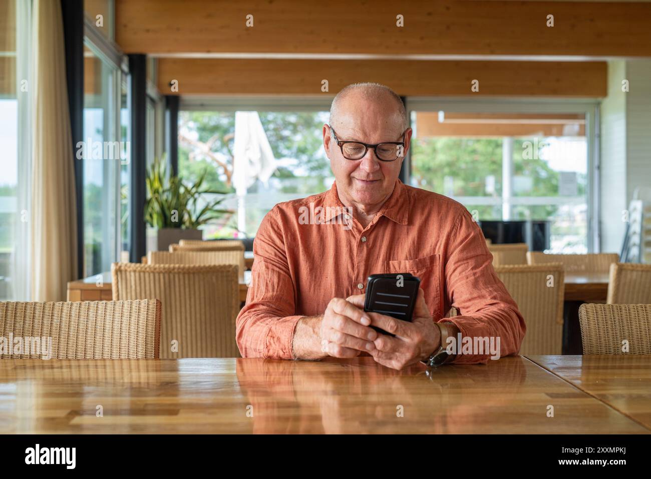 Senior Finnish Man Using Mobile Phone in Restaurant during Autumn ...