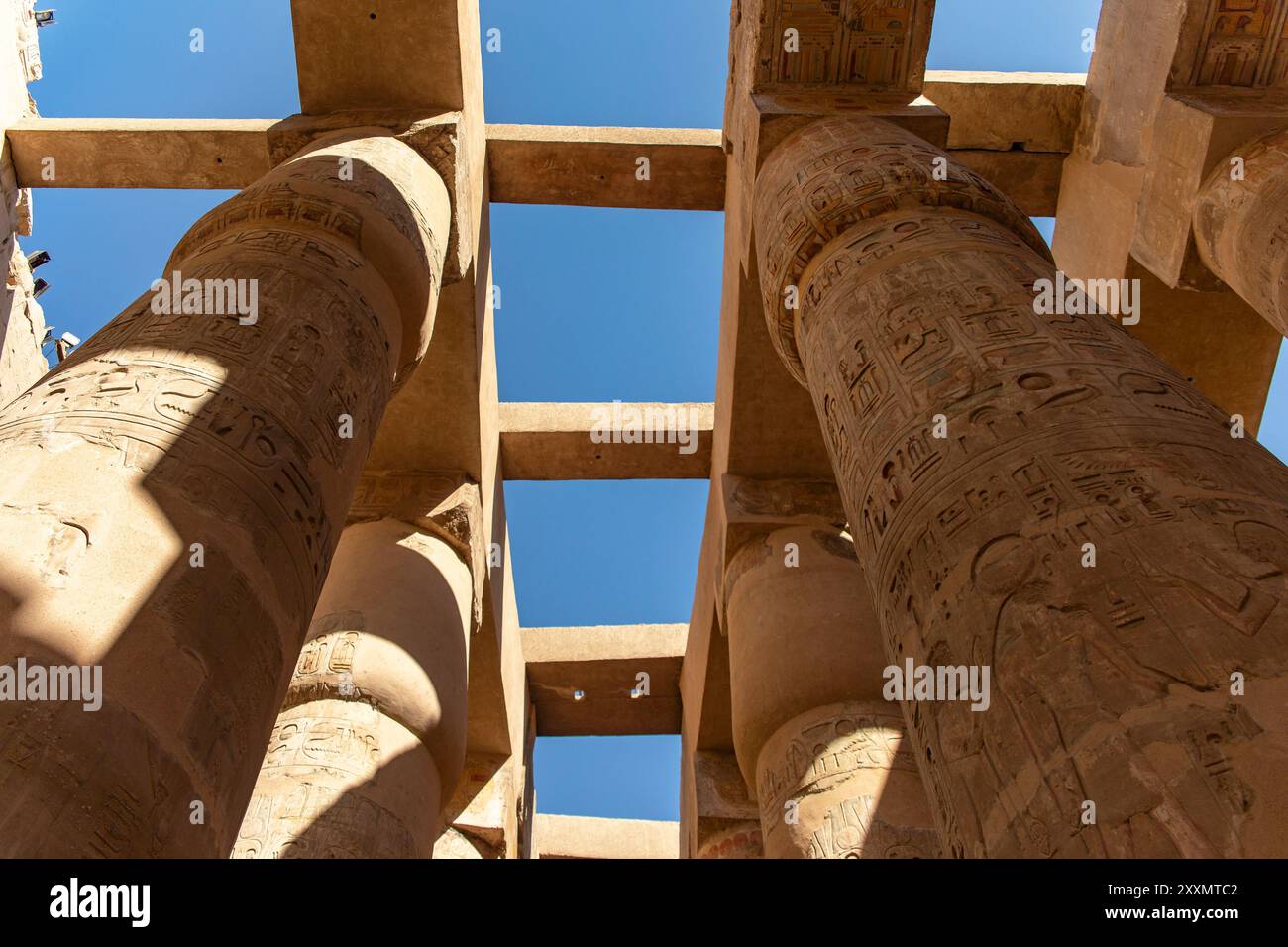 These towering pillars in Karnak's Great Hypostyle Hall stand as ...