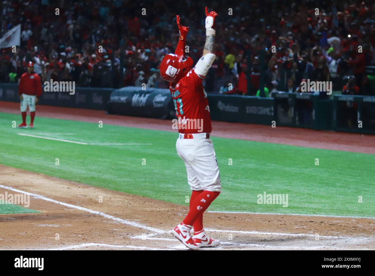 Juan Carlos Gamboa #47 of Diablos Rojos del Mexico celebrating during ...
