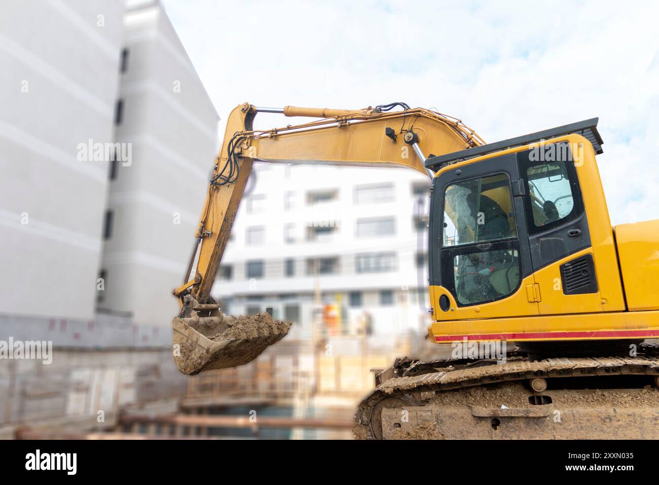 Construction excavator at work on construction site. Project in ...