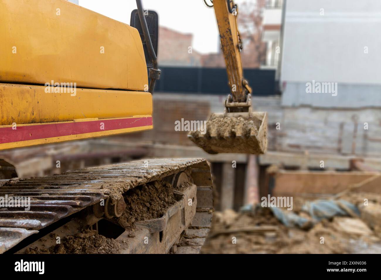 Construction excavator at work on construction site. Project in ...