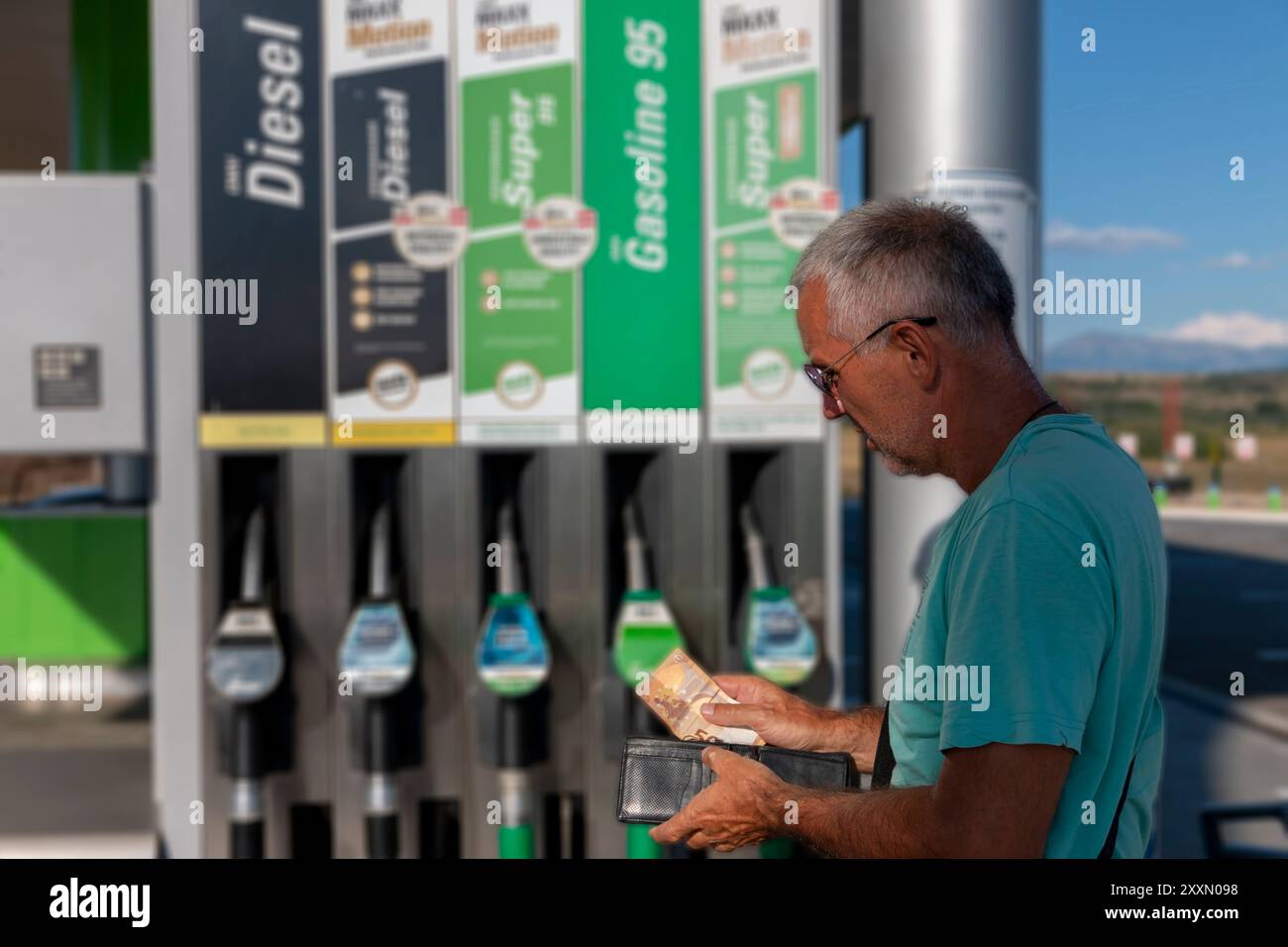 Mature man counting banknotes hi-res stock photography and images - Alamy