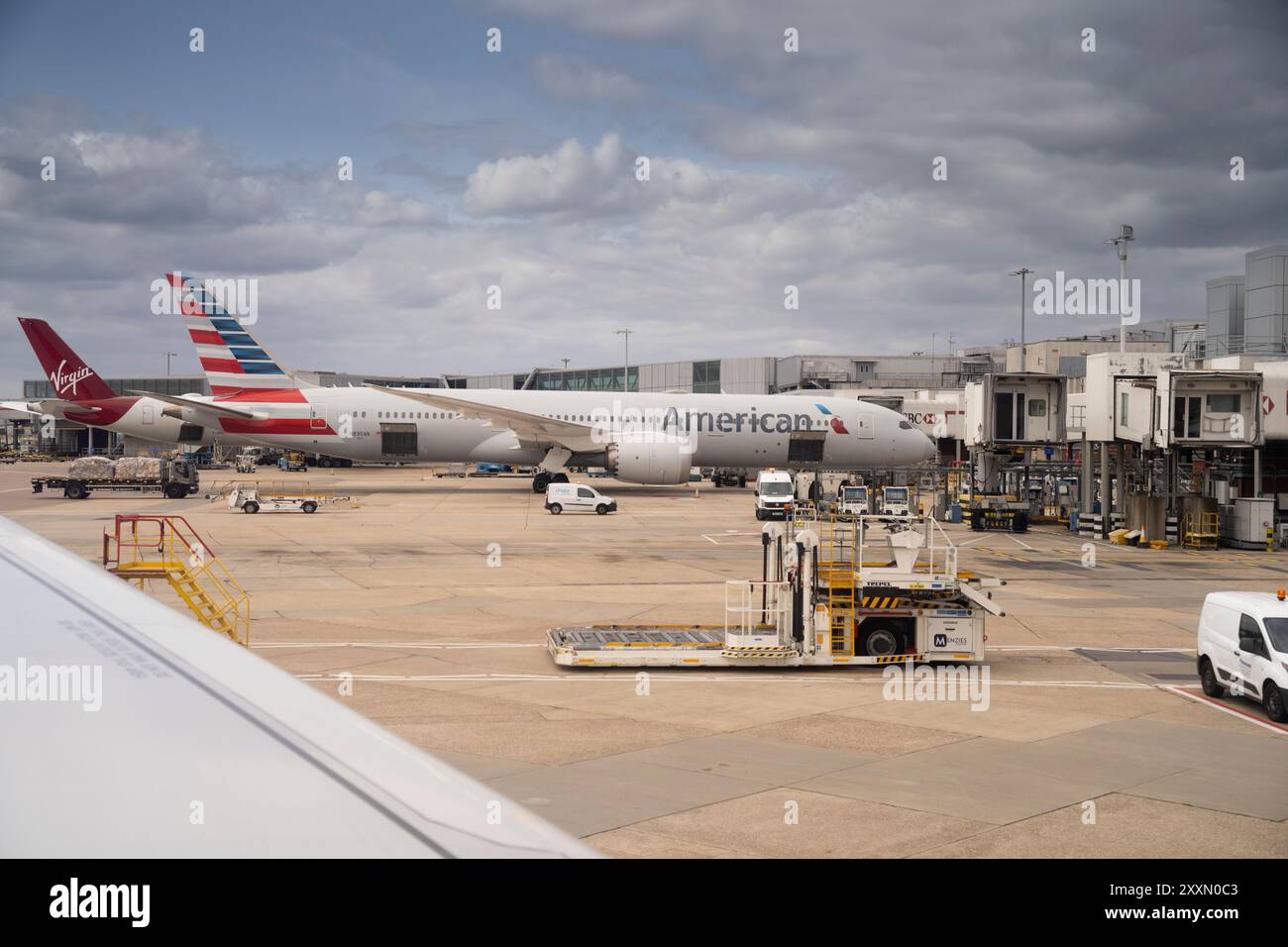 An American Airlines Boeing 787 Dreamliner sits at a gate at London ...