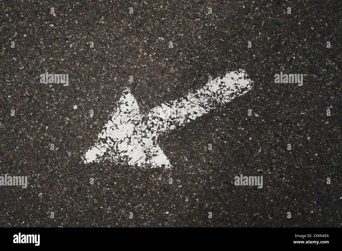 Road marking, directional arrow pointing to the lower left on an ...