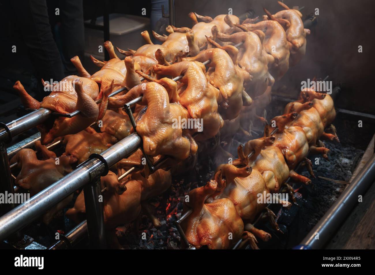 Delicious chicken roasting on grill hi-res stock photography and images ...