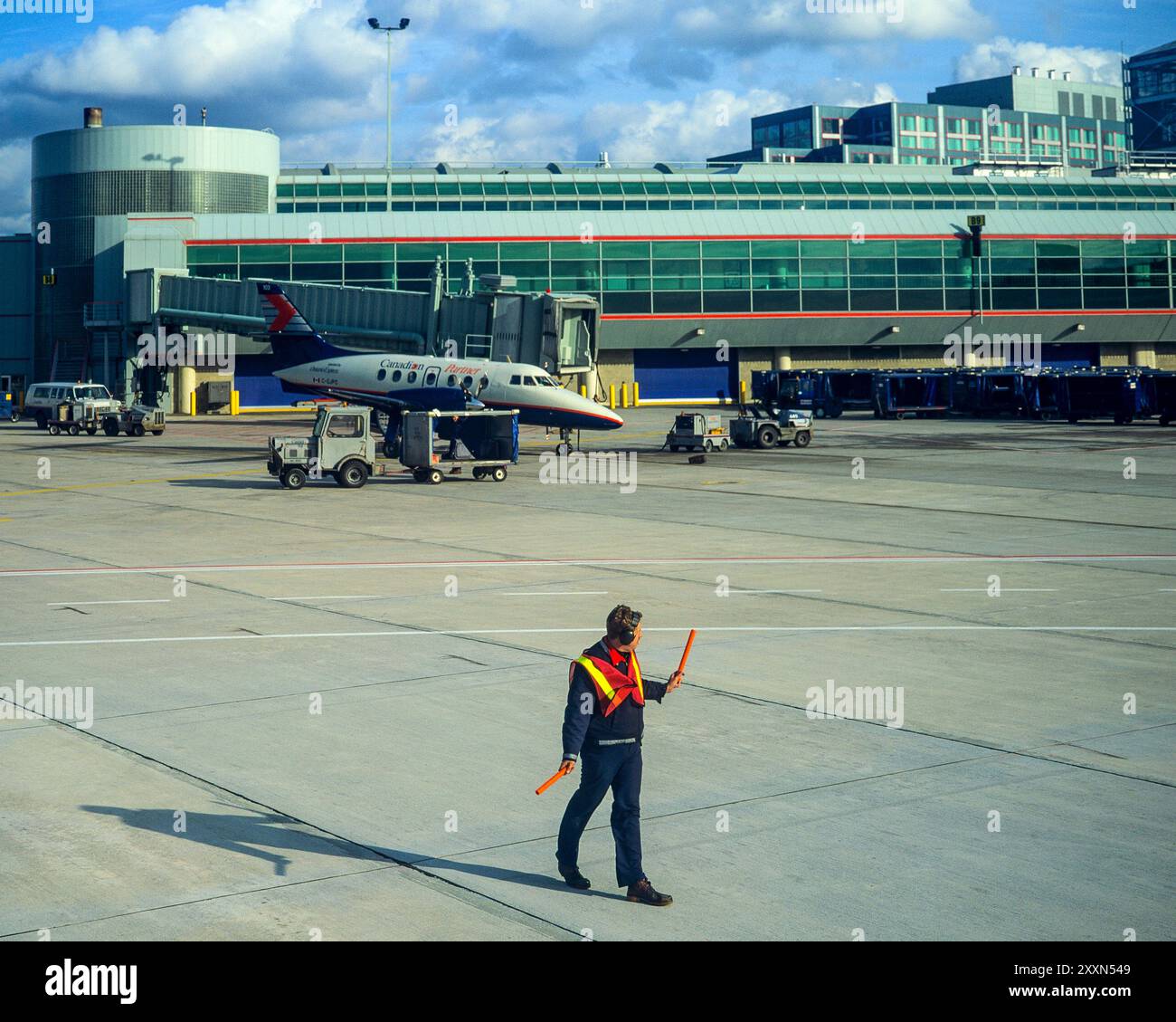 Aircraft marshaller, apron, Pearson airport, Toronto, Ontario state ...