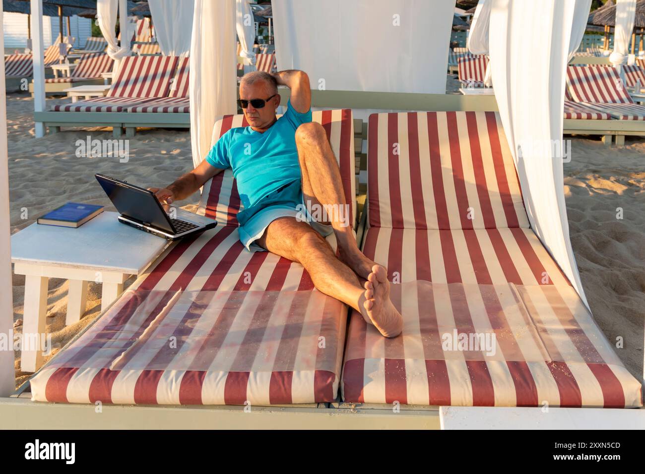 Businessman typing on laptop summer hi-res stock photography and images ...