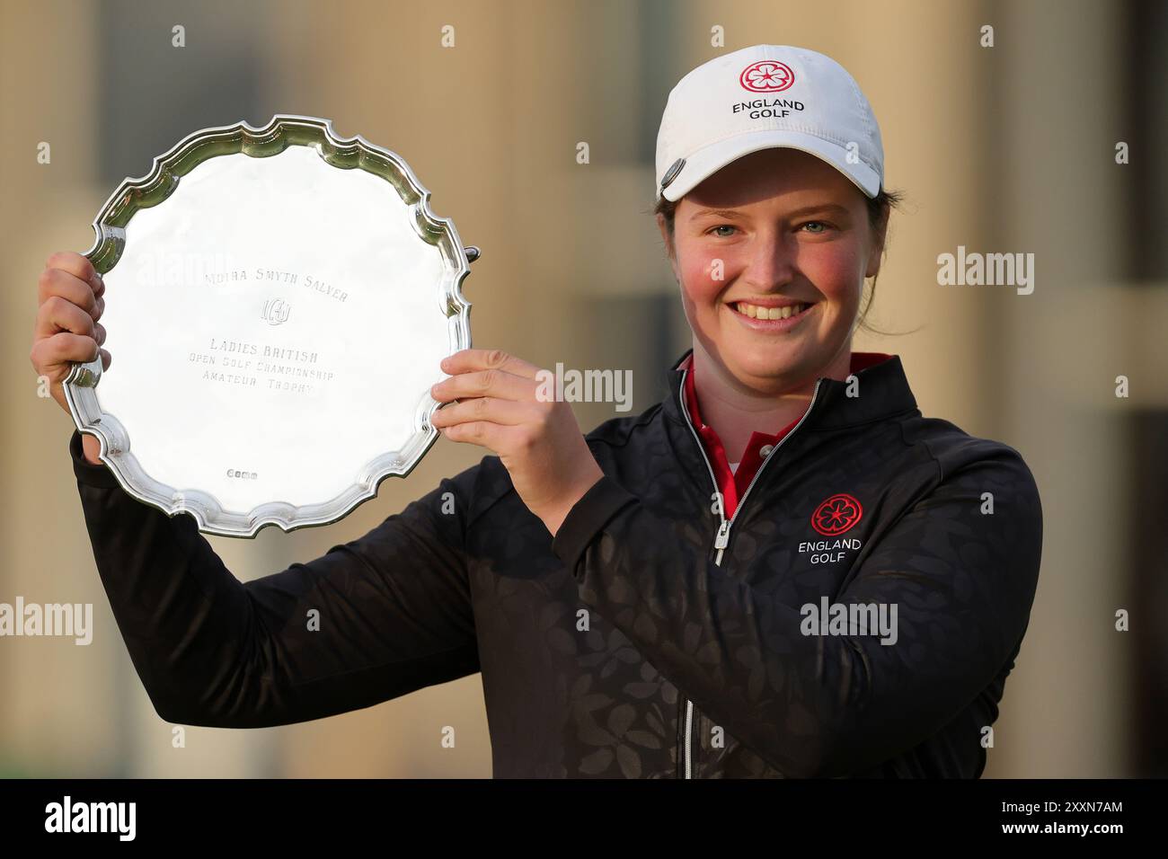 Leading amateur Lottie Woad with her trophy after day four of the 2024 AIG Women's Open at St ...