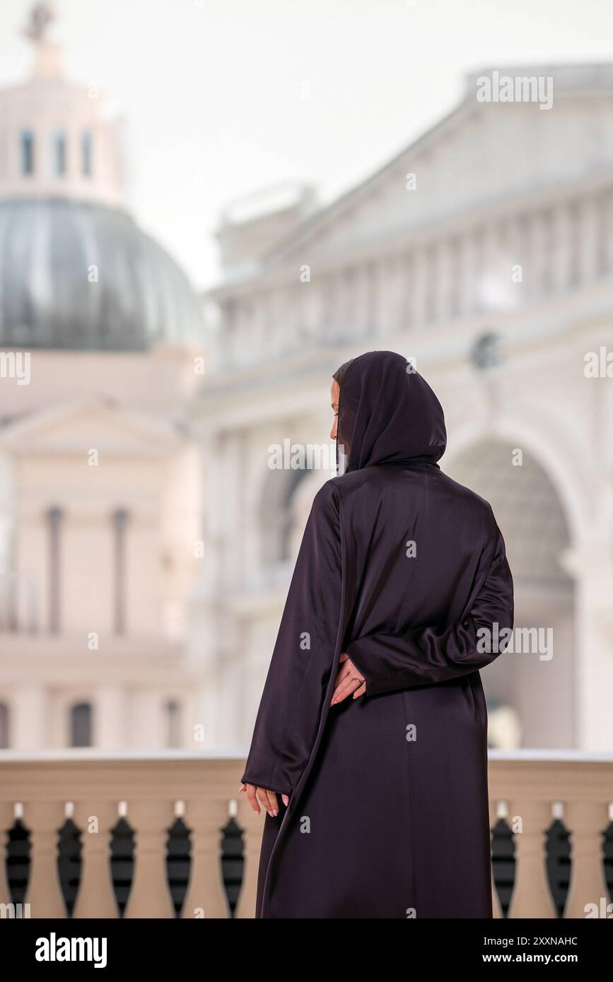 Asian Model poses for Arabic designer Abaya on isolated background ...