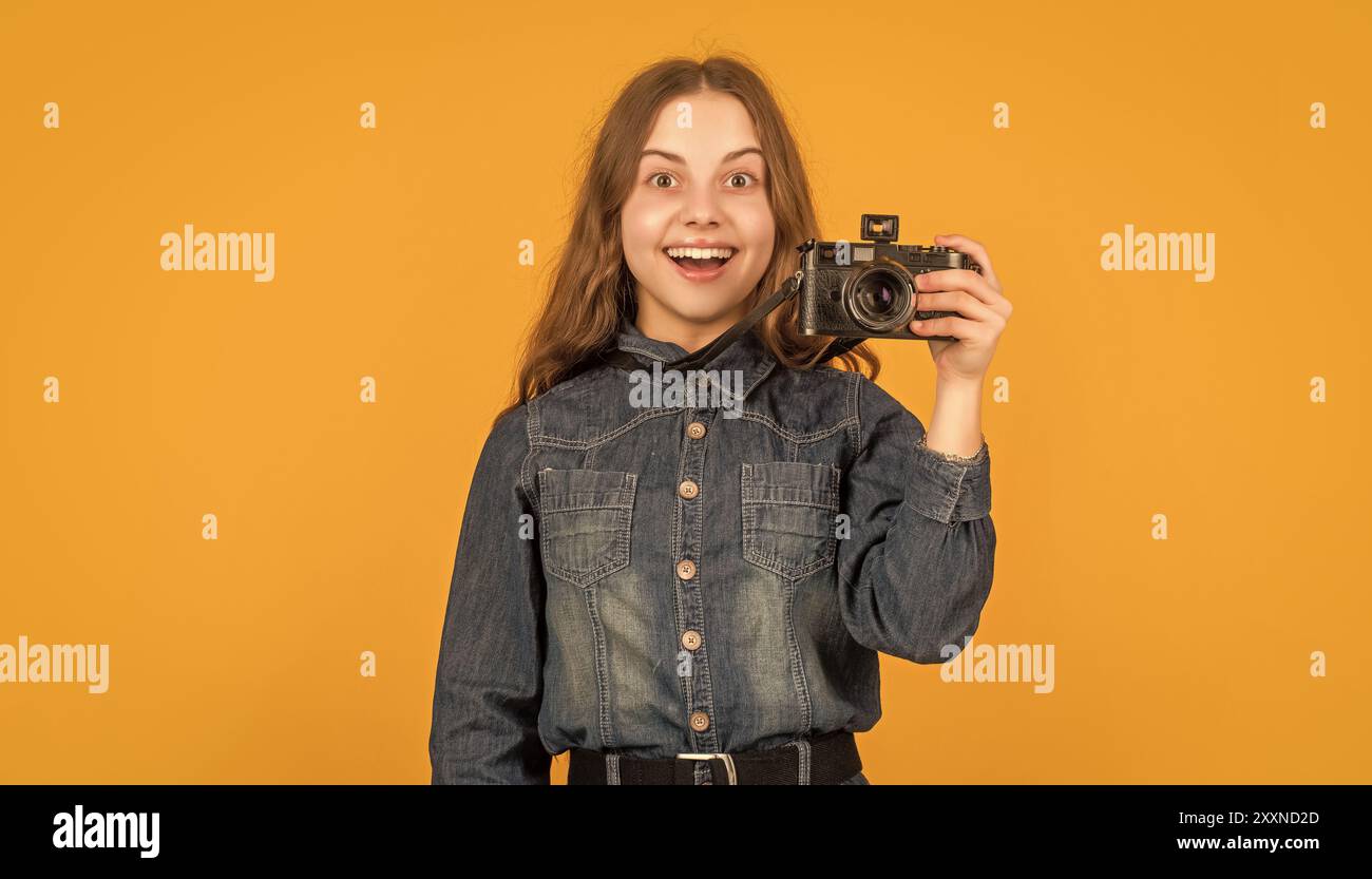 Happy surprise. Surprised kid holding camera. Looking with surprise ...