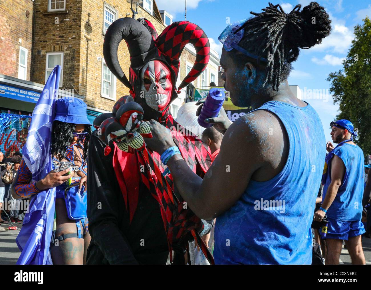 London, UK, 25th Aug 2024. Participants with the 'Blue Dutty Mas' group ...