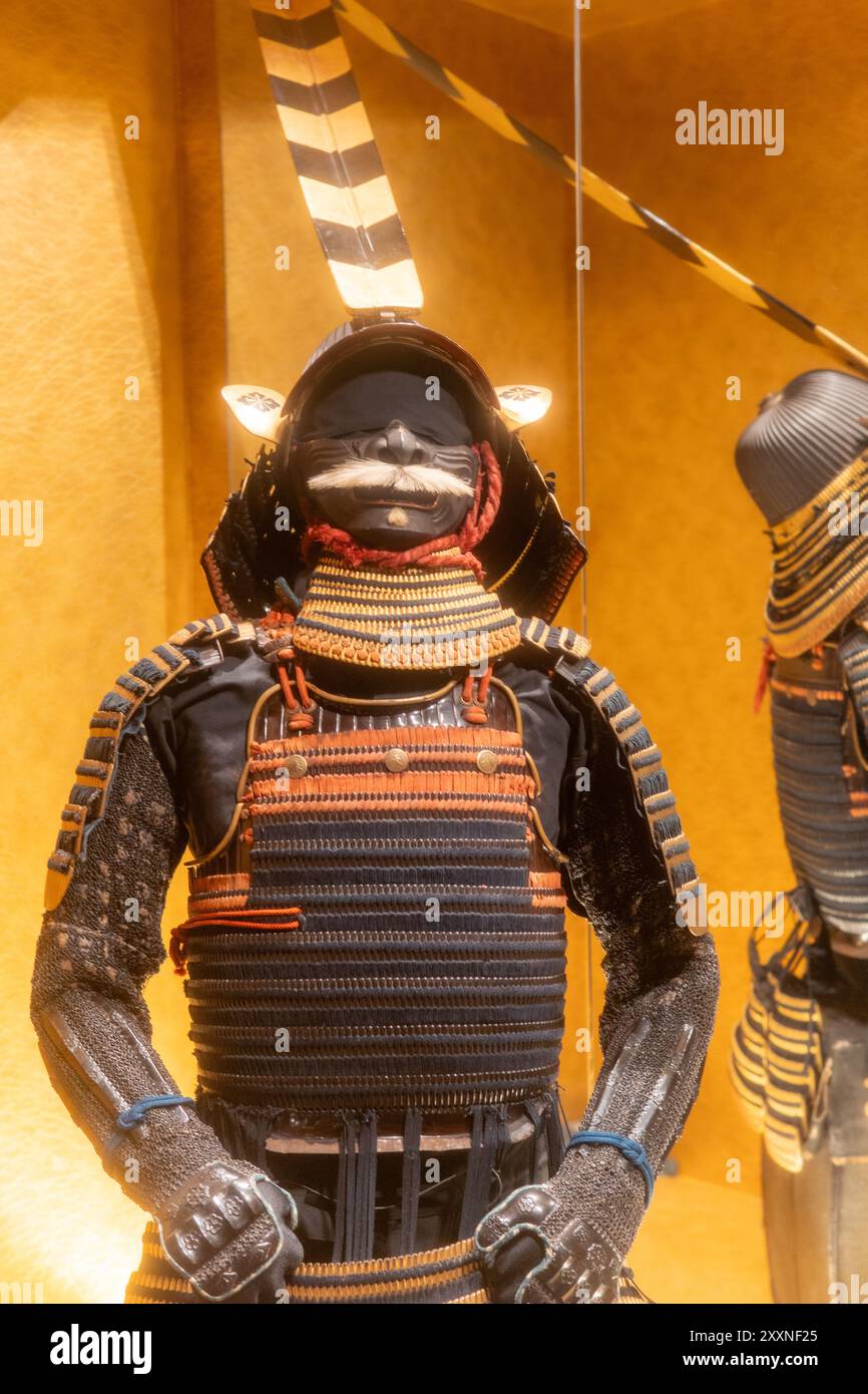 A collection of intricately detailed Japanese samurai armor suits ...