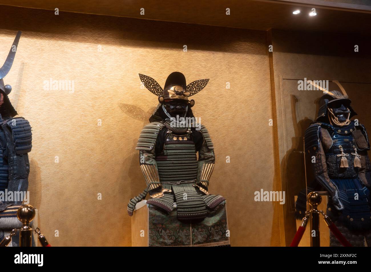 A collection of intricately detailed Japanese samurai armor suits ...