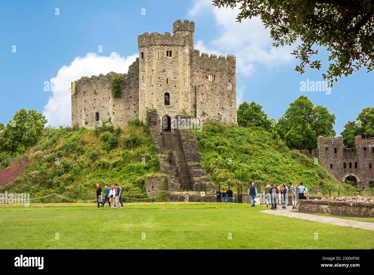 Visitors in the castle and castle grounds in the welsh capital city of ...