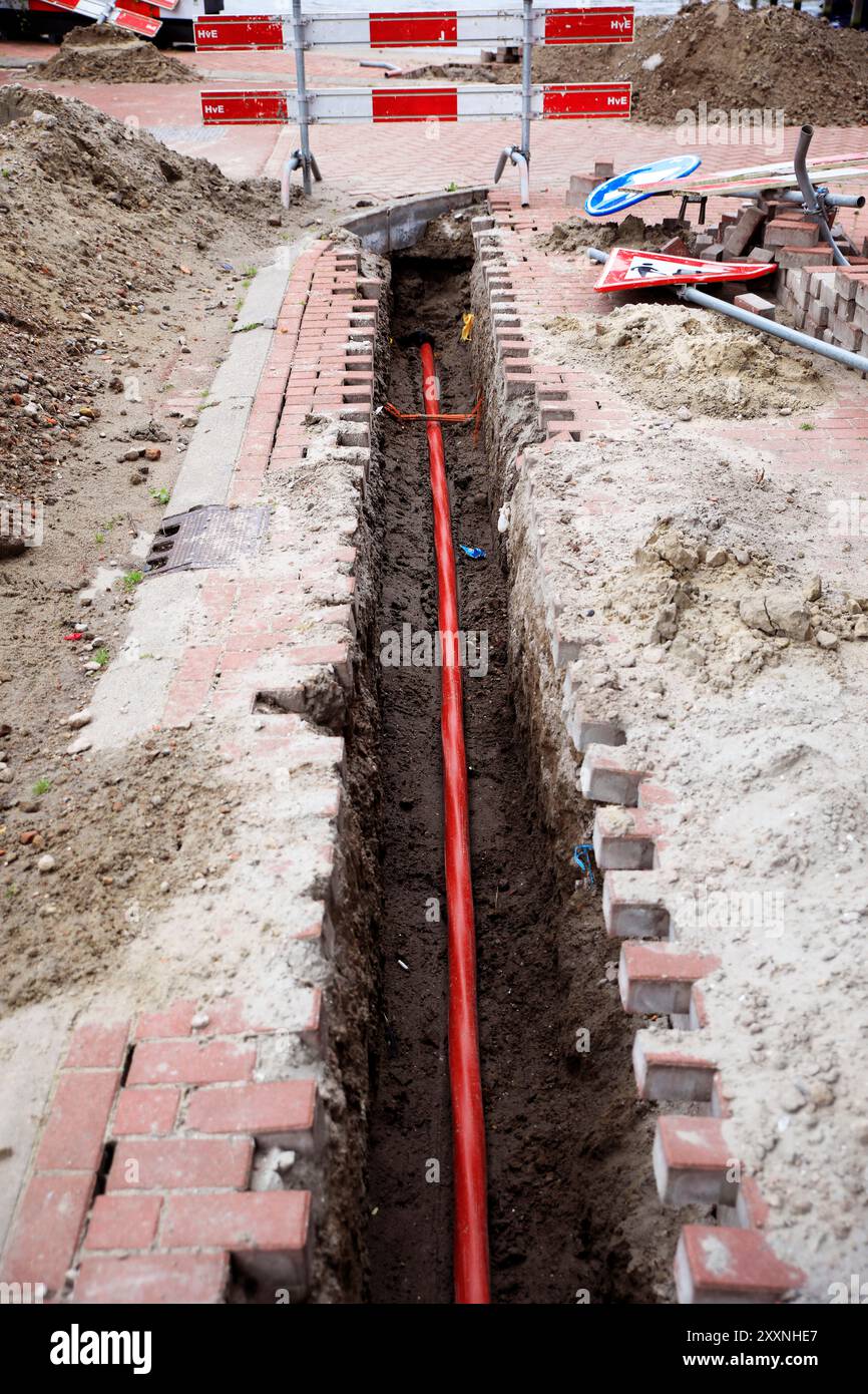 Installation of a high voltage cable in a residential area, The ...