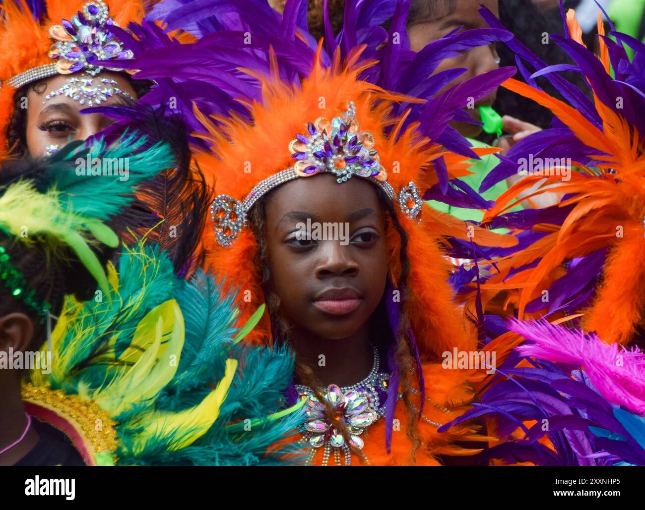London, UK. 25th Aug, 2024. Young participants wear colourful costumes ...