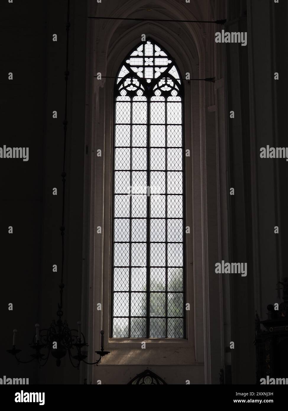 Gdansk, Poland - July 13, 2024: A tall gothic window with intricate ...