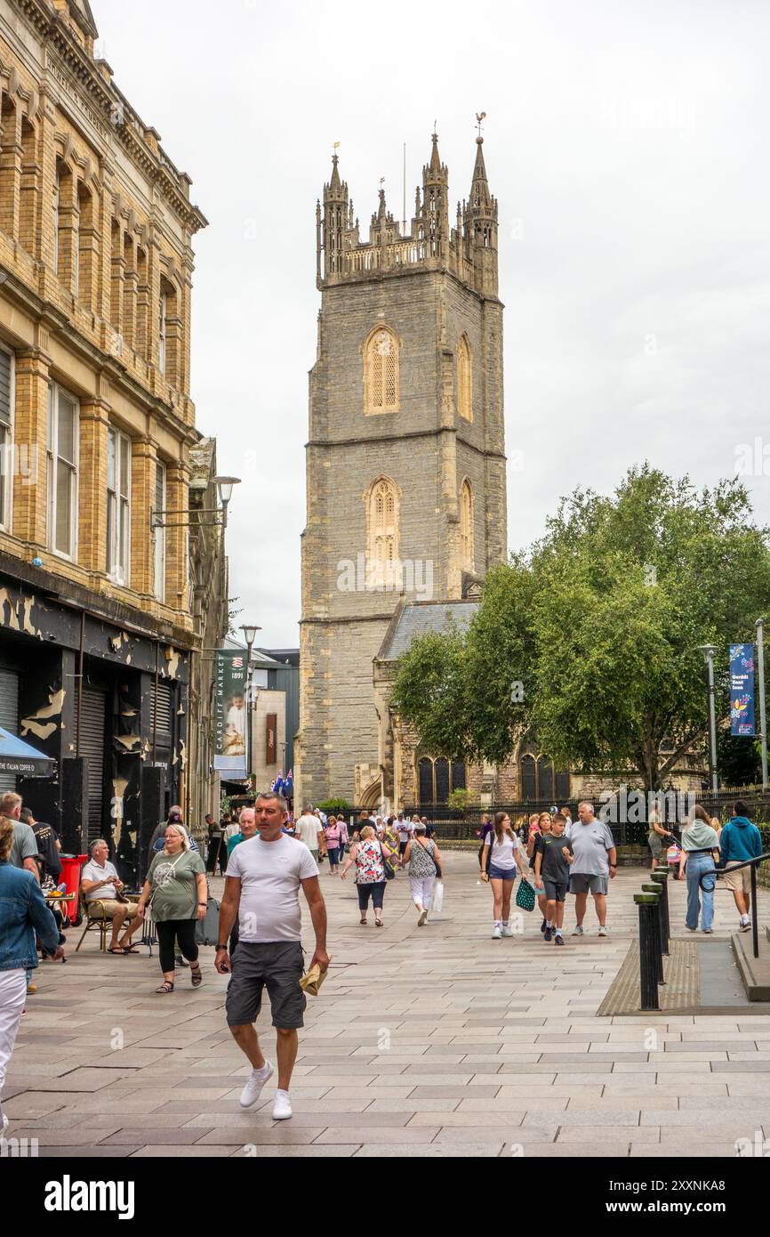 People shopping and tourists along Trinity Street in the Welsh capital ...