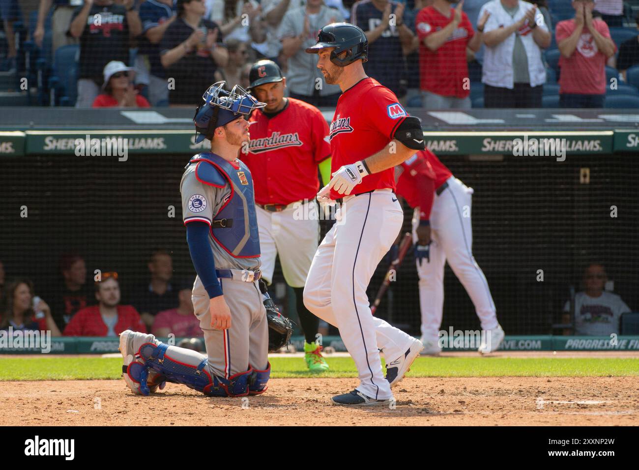 Cleveland Guardians' David Fry, right, crosses home plate after hitting ...