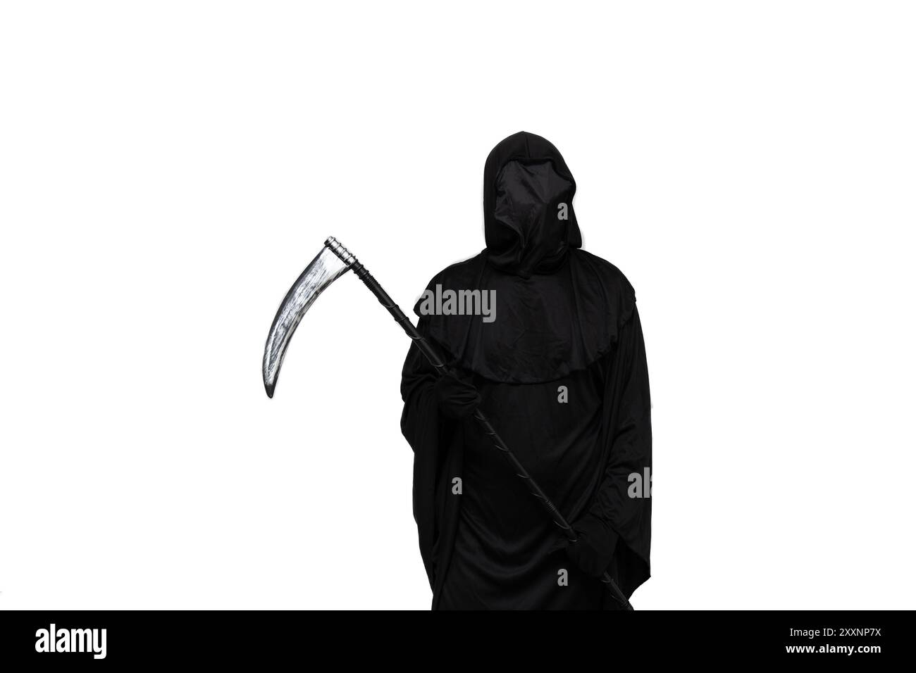The grim reaper, dressed in a Halloween costume with a dark cloak ...