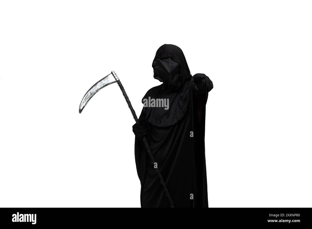 The grim reaper, dressed in a Halloween costume with a dark cloak ...