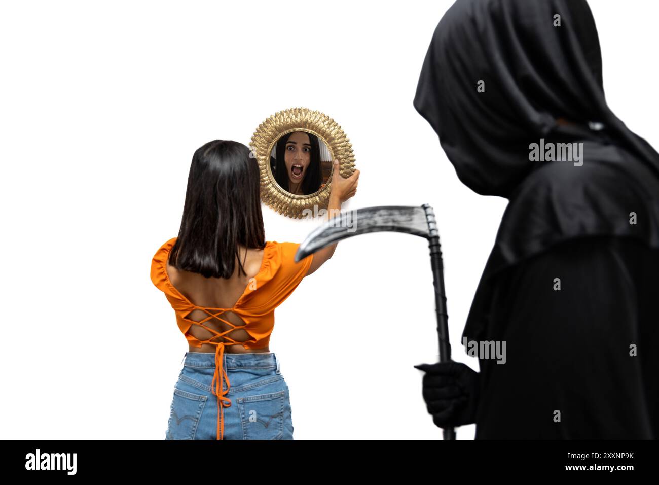 terrified young woman, viewed from behind and reflected in a mirror, is ...