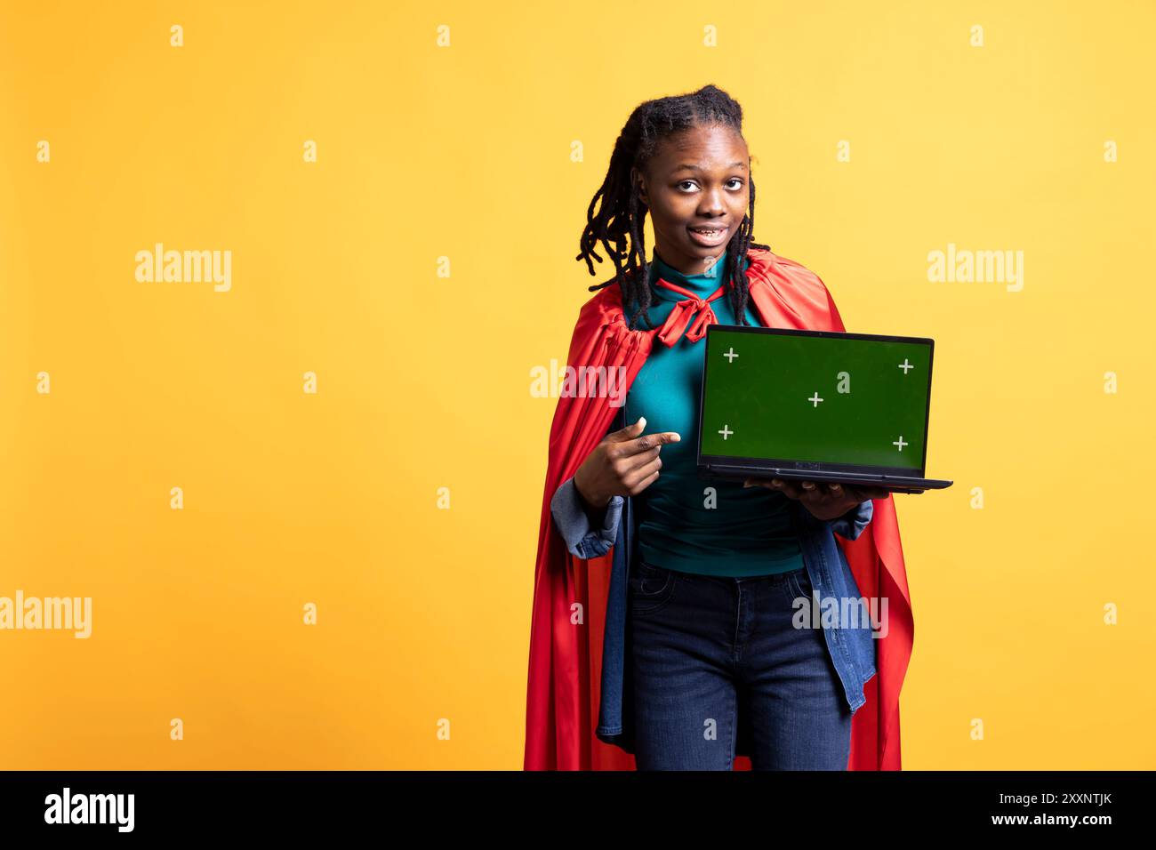 Portrait of BIPOC woman portraying superhero with cape showcasing ...