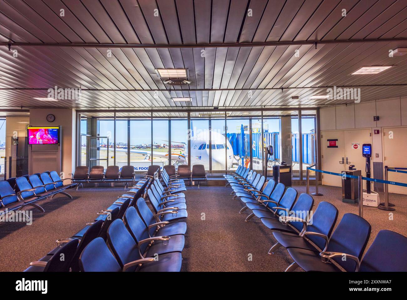 Beautiful view of empty airport gate seating with airplane outside ...