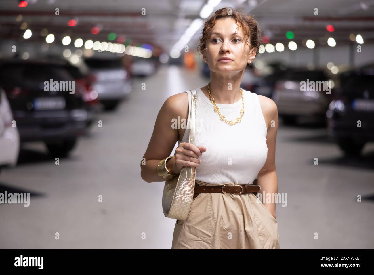 Woman driving parking garage hi-res stock photography and images - Alamy