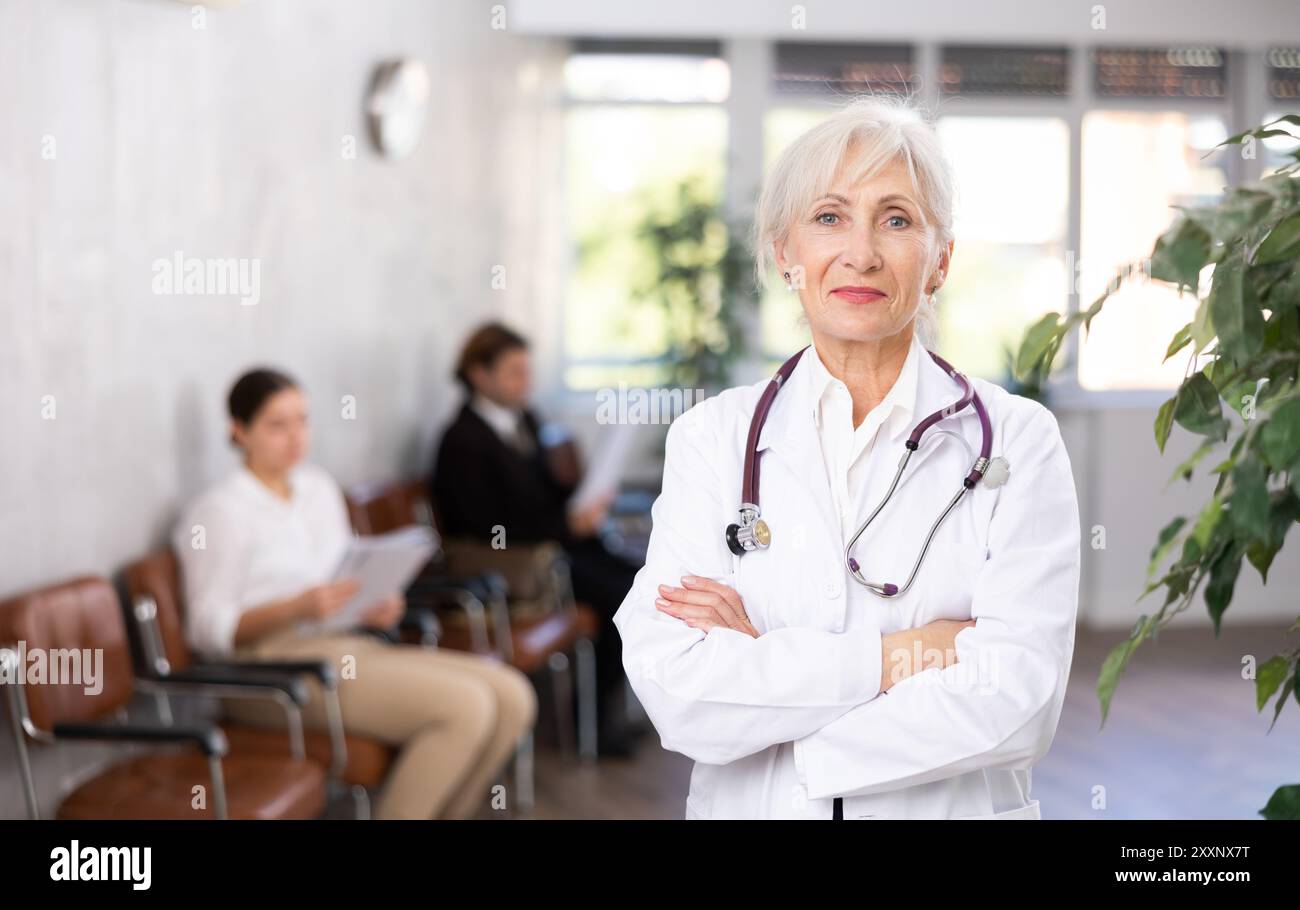 Patients queue clinic reception hi-res stock photography and images - Alamy