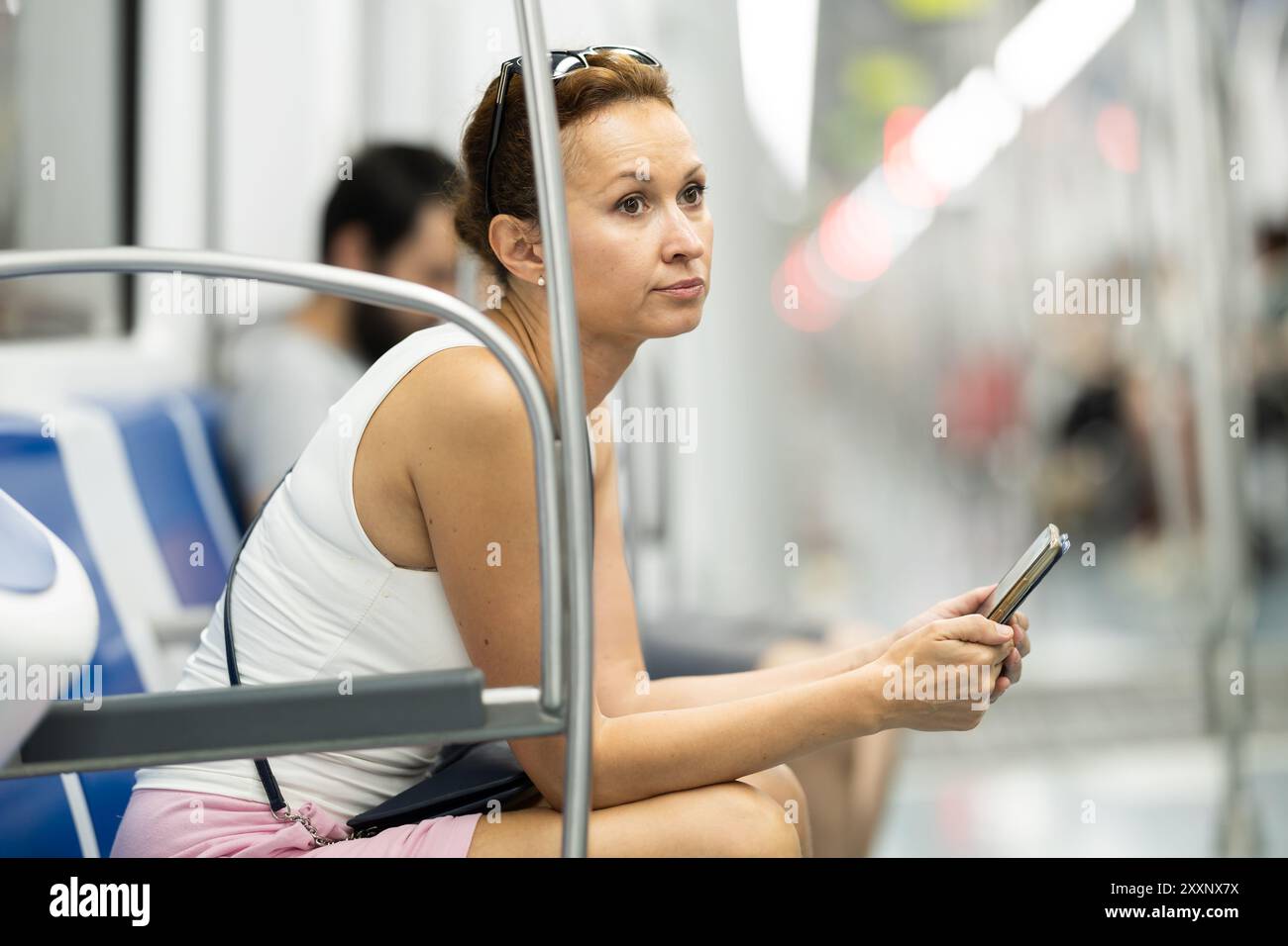 Portrait of pretty woman commuting in city using subway train Stock ...