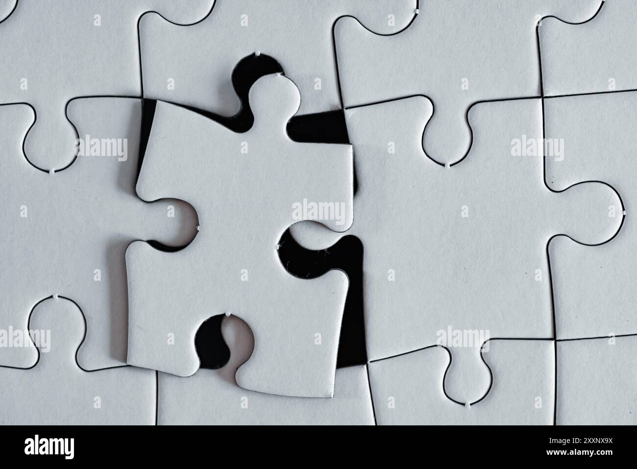 Last piece of a puzzle near its destined position Stock Photo - Alamy