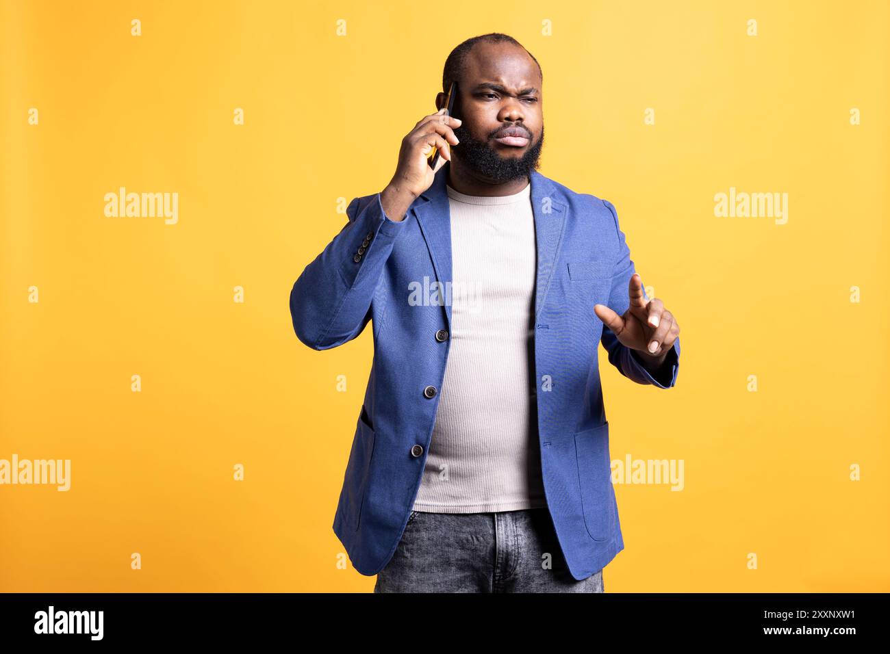 Upset man with frown on face after arguing with friends during phone ...