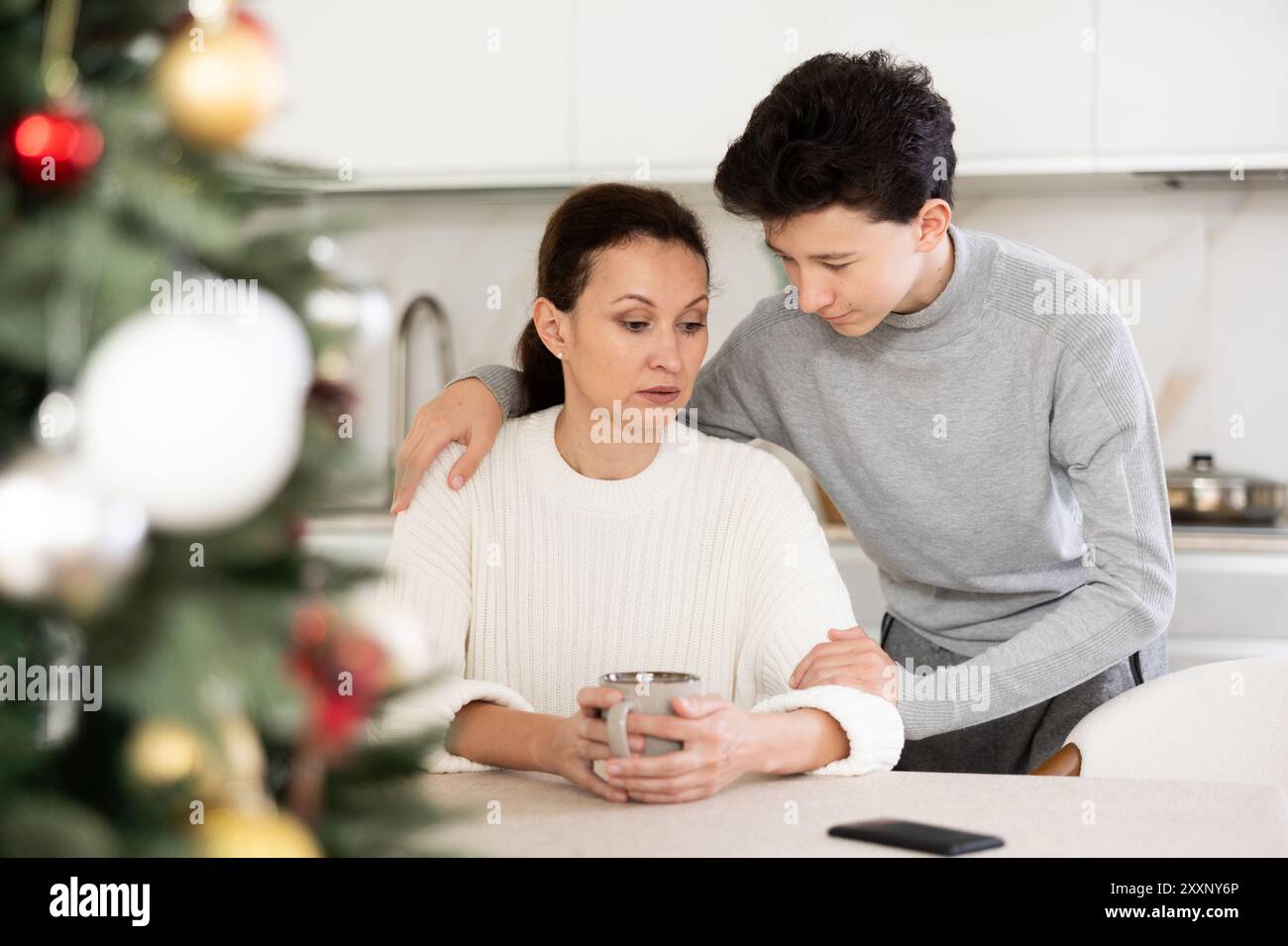 Boy asking mother for forgiveness Stock Photo - Alamy