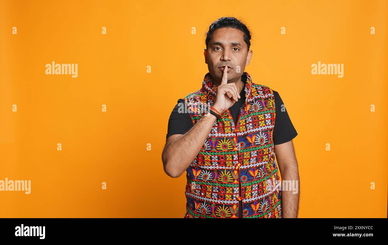 Annoyed indian man doing shushing hi-res stock photography and images ...