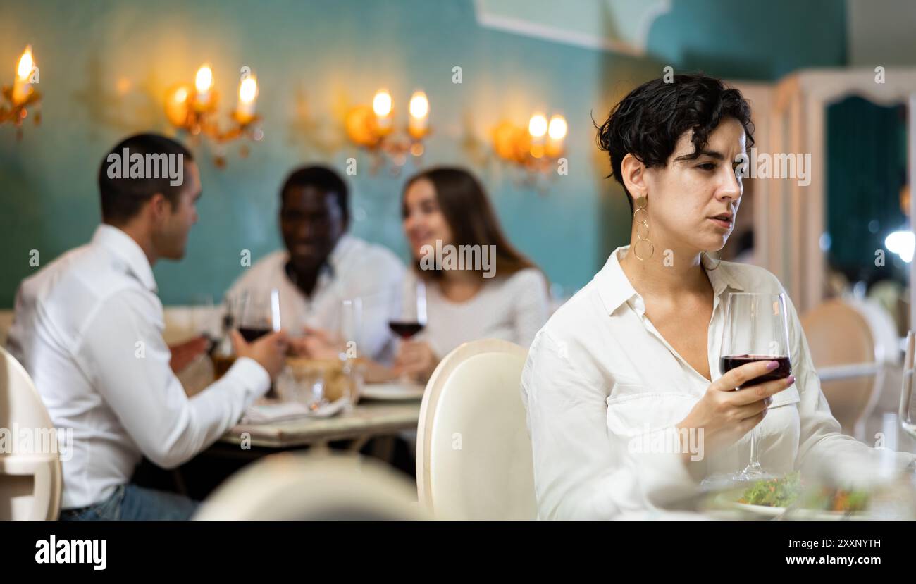 Single bored woman in the restaurant Stock Photo - Alamy