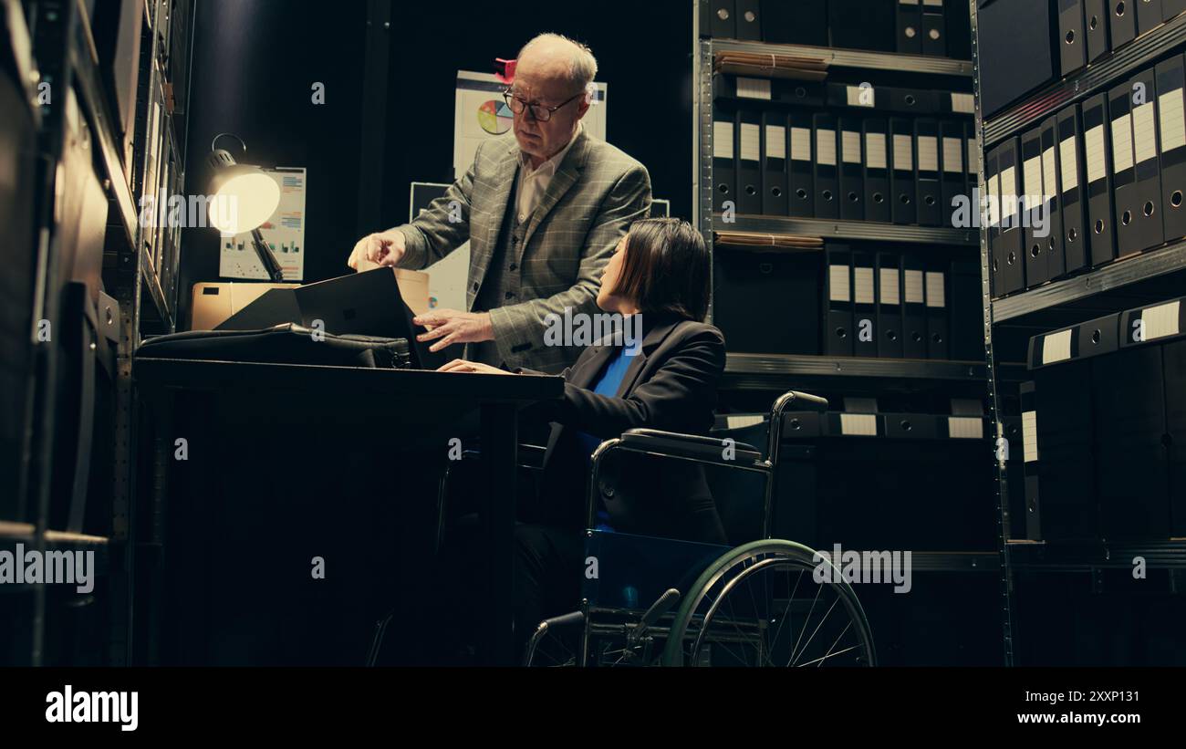 Team detectives analyzing surveillance records hi-res stock photography ...