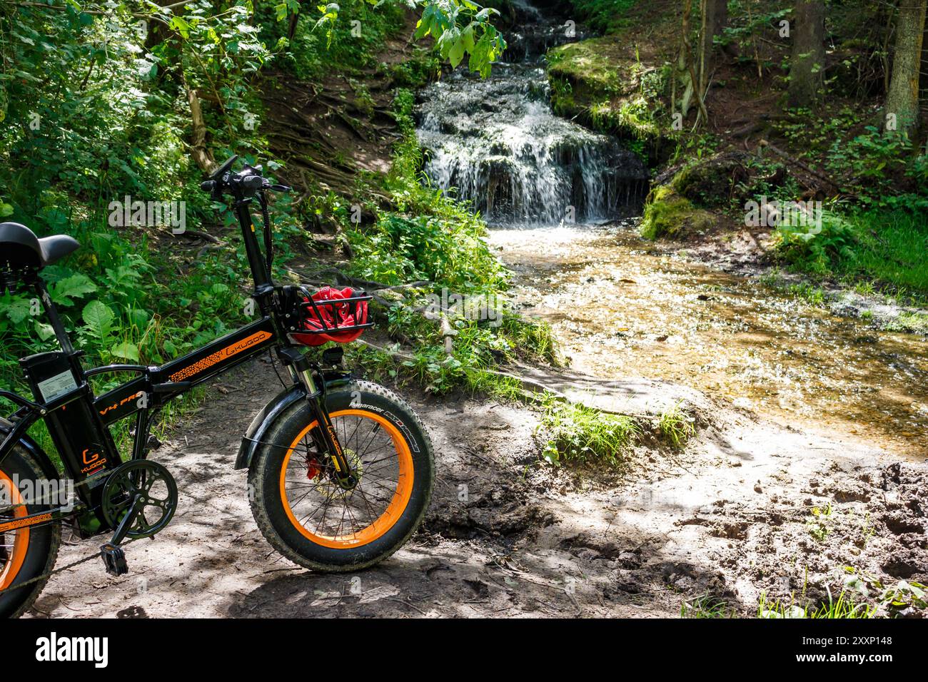 Electric bike ride in nature. Kugoo V4 Pro fatbike against the backdrop ...