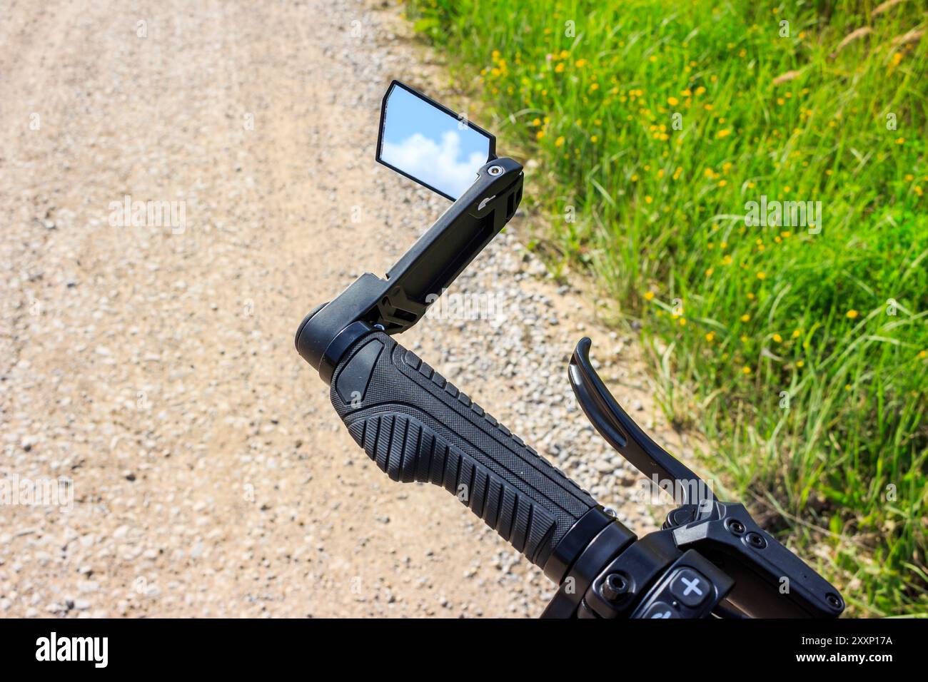 Left side bicycle handlebar with rubber grips and rear view mirror ...