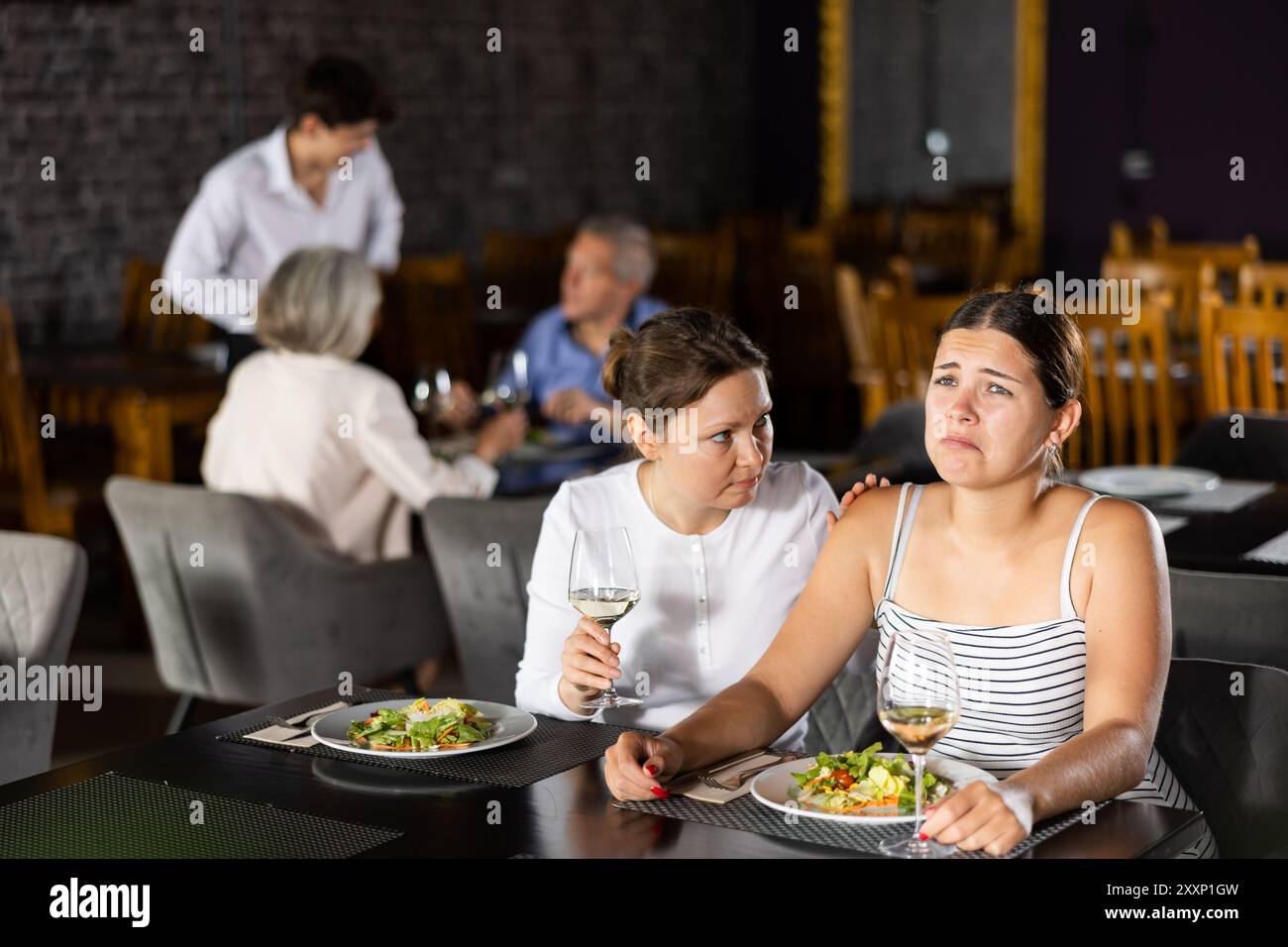 Sad upset young woman shares with female friend about difficult period ...