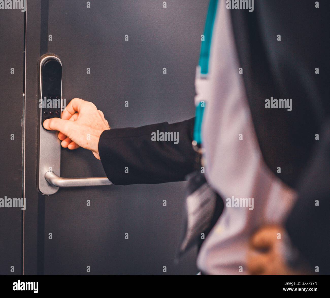Business men opening an electric door Stock Photo - Alamy