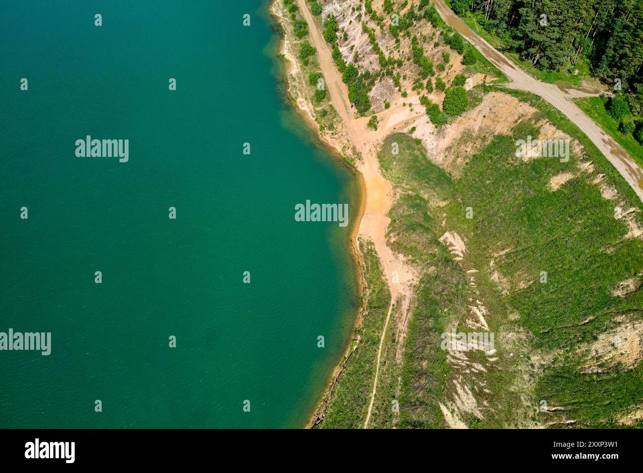 Turquoise waters of a flooded sand quarry, view from above Stock Photo ...