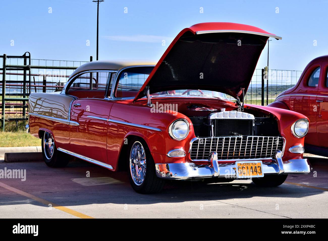 Red and cream 55 Chevy Hot Rod with hood up Stock Photo - Alamy