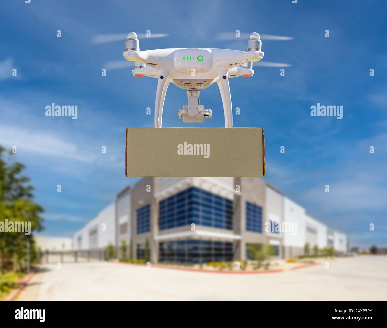 Unmanned Aircraft System (UAS) Quadcopter Drone Carrying Blank Package ...