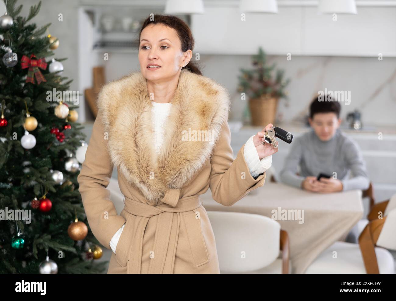 Mother leaving son home alone Stock Photo - Alamy