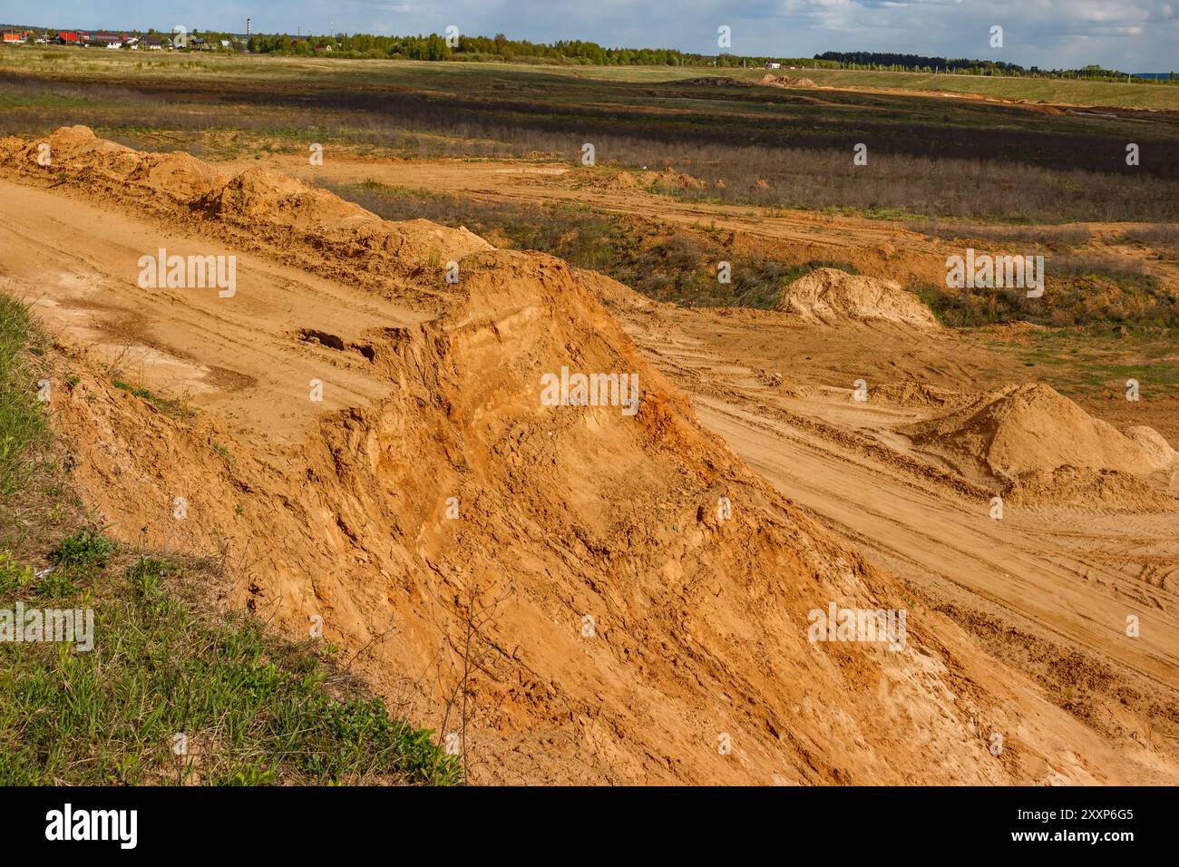 Road embankment on a sand quarry ending with a sharp cliff Stock Photo ...
