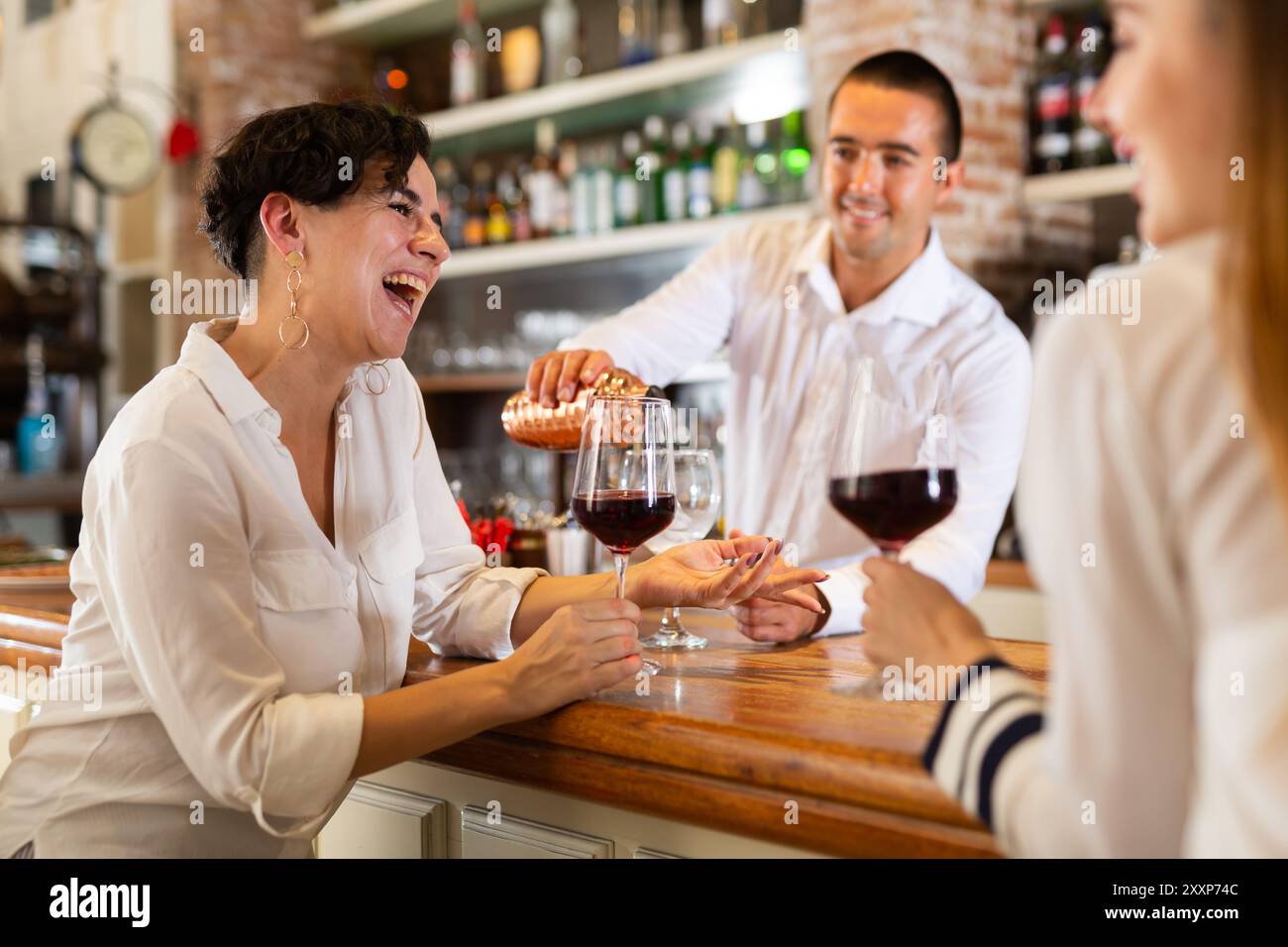 Two female friends in the bar Stock Photo - Alamy