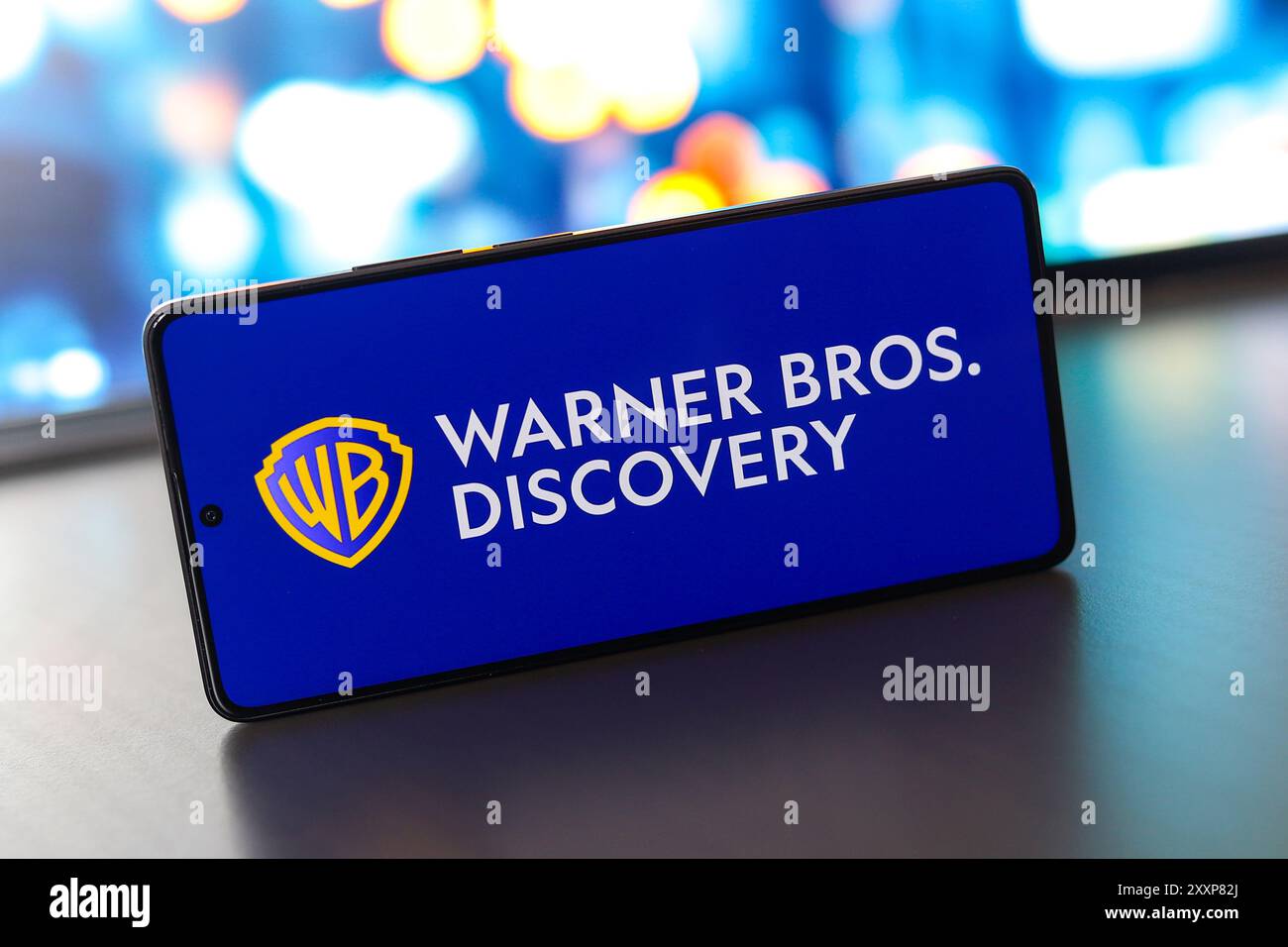 In this photo illustration, the Warner Bros. Discovery, Inc. logo is displayed on a smartphone ...