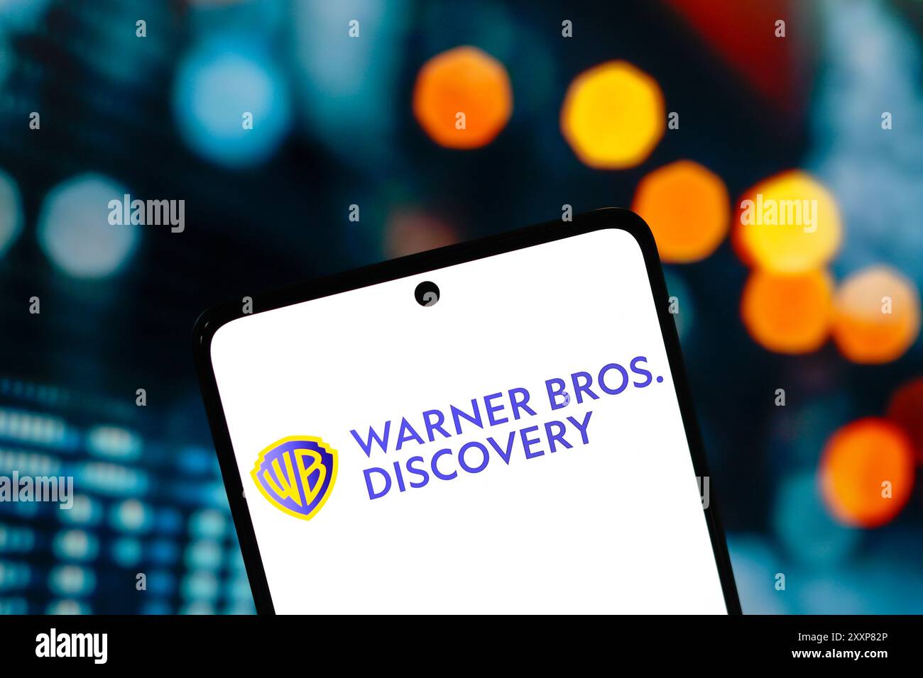 In this photo illustration, the Warner Bros. Discovery, Inc. logo is displayed on a smartphone ...